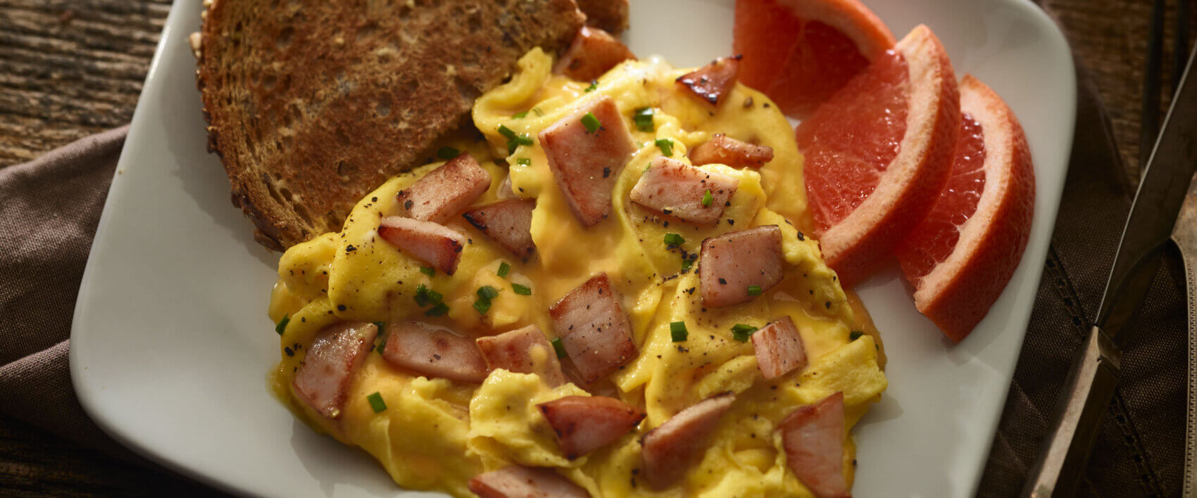 Cheesy Canadian Bacon and Egg Scramble - HORMEL® BLACK LABEL® Bacon