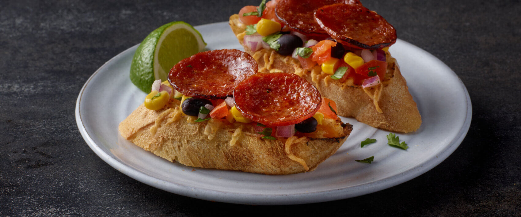 Sliced Chorizo Toasts with Black Bean Salsa - HORMEL® Pepperoni